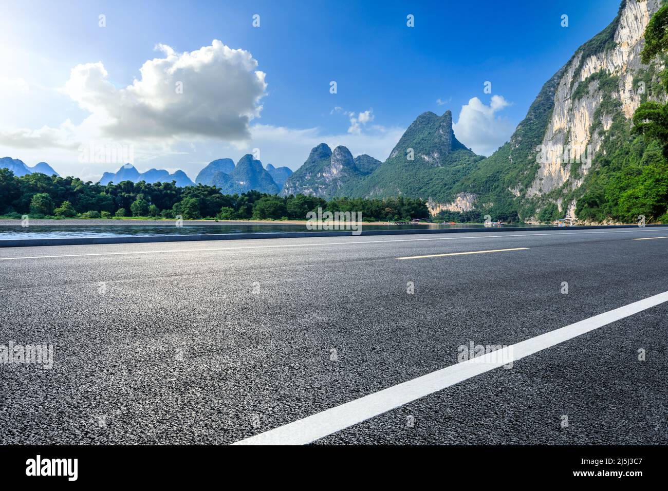 Asphalt highway and mountain natural scenery under blue sky in summer ...
