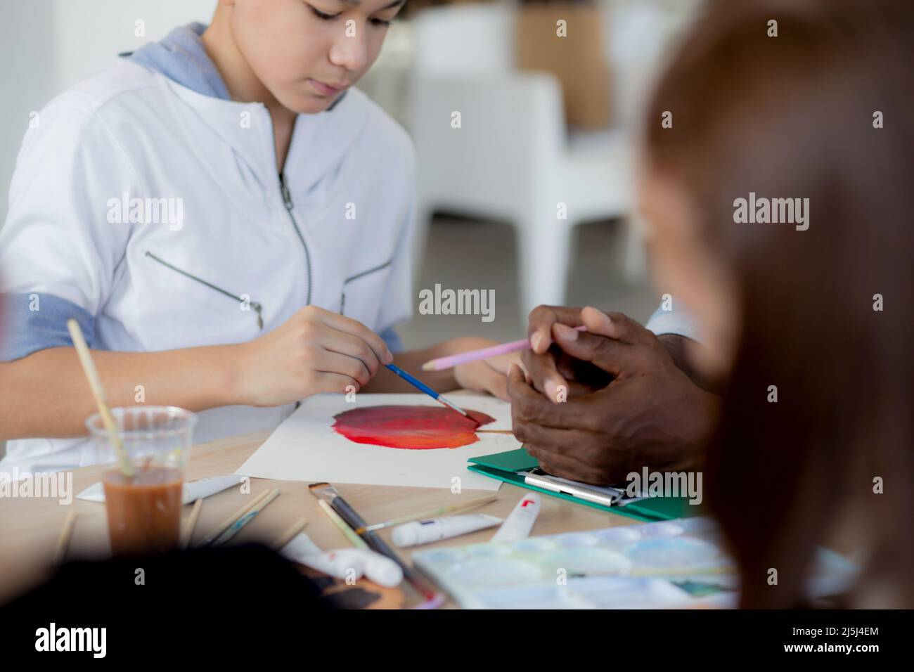 Group of student sitting and studying and learning drawing with teacher ...