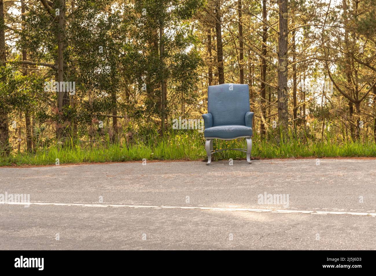 Old blue chair with metal legs, outdoor area in Carmel by the sea ...