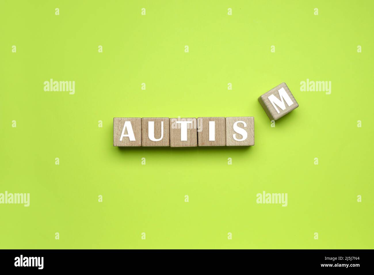 Word AUTISM made of cubes on green background Stock Photo - Alamy