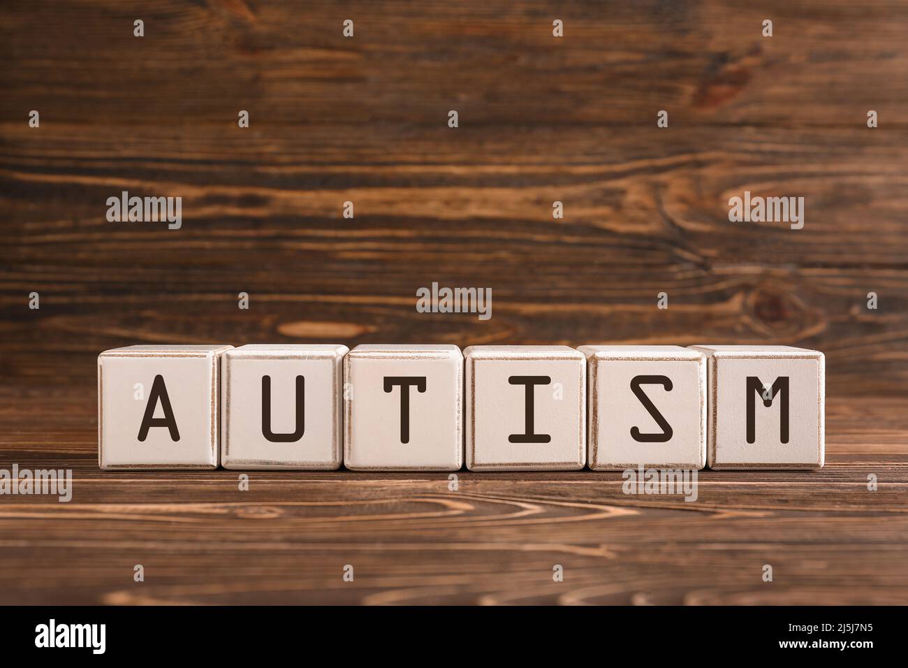 Word AUTISM made of cubes on wooden background Stock Photo - Alamy