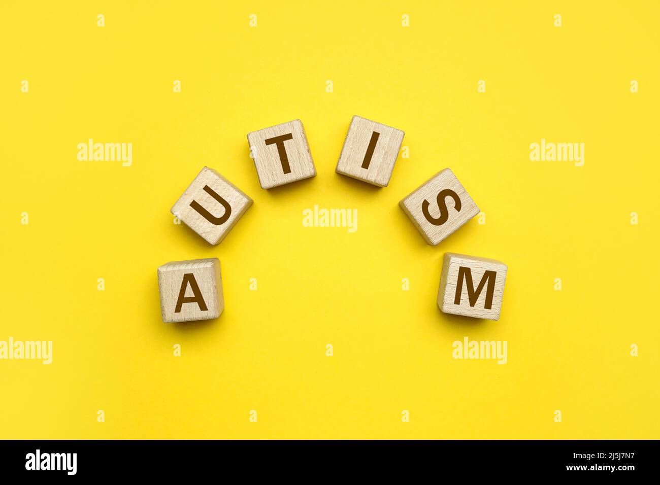 Word AUTISM made of cubes on yellow background Stock Photo - Alamy