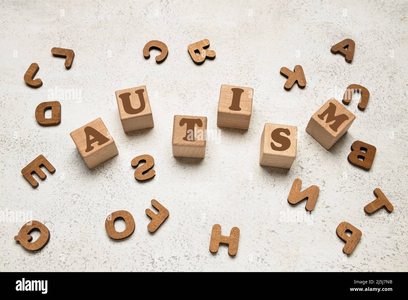 Word AUTISM made of cubes and different letters on light background ...