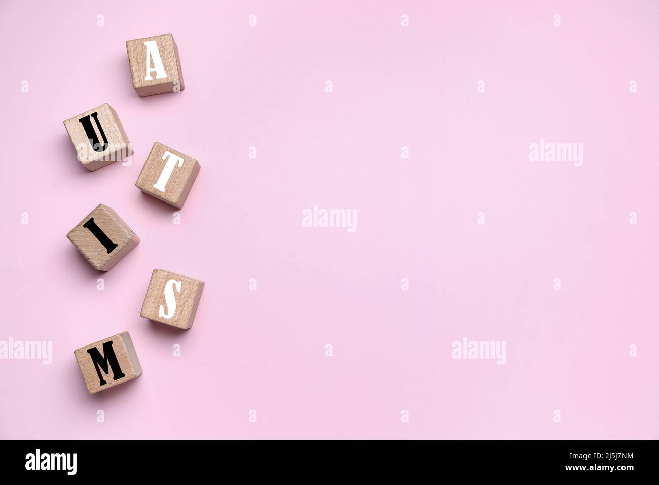 Word AUTISM made of cubes on pink background Stock Photo - Alamy