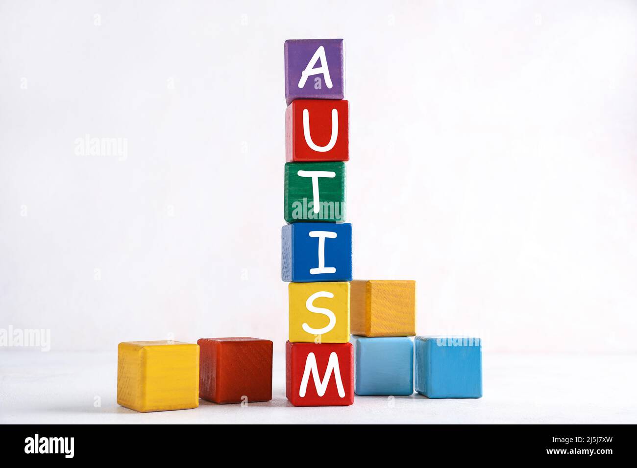 Cubes with word AUTISM on white background Stock Photo - Alamy