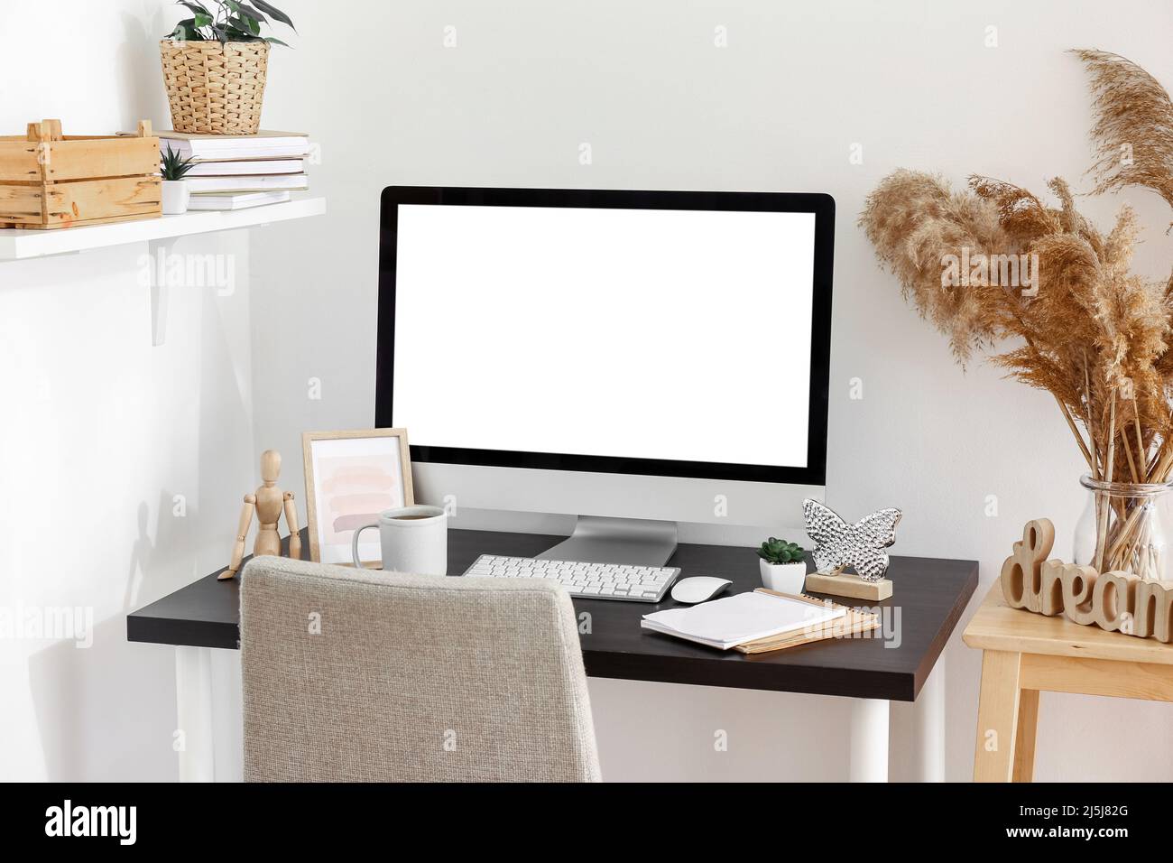 Modern workplace with computer in light room interior Stock Photo - Alamy