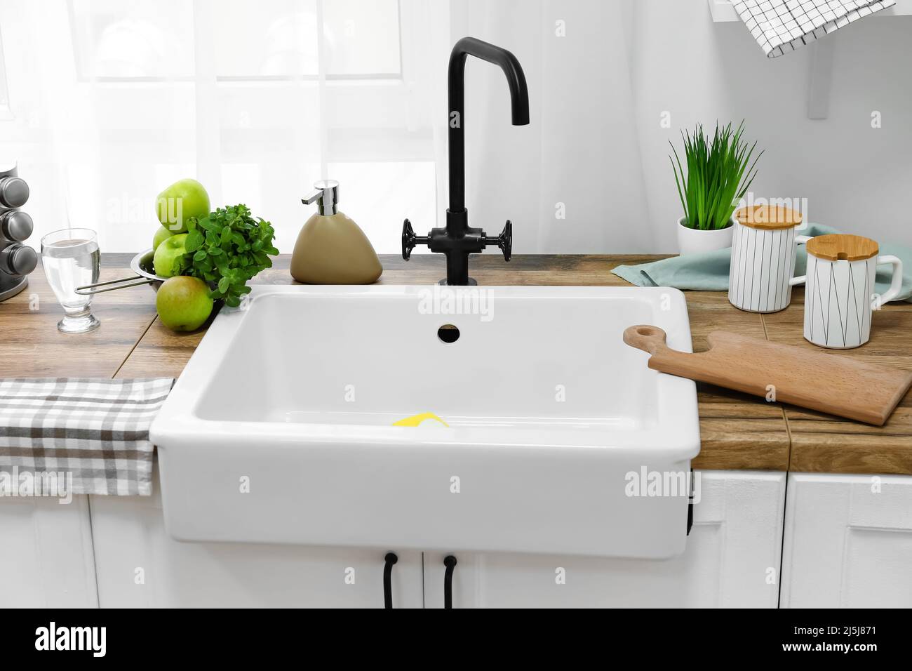 Counter with modern sink and kitchen utensils Stock Photo - Alamy