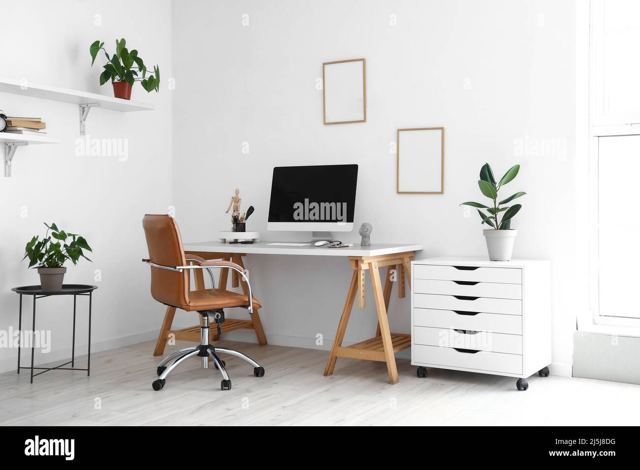 Interior of light room with comfortable workplace and modern computer ...
