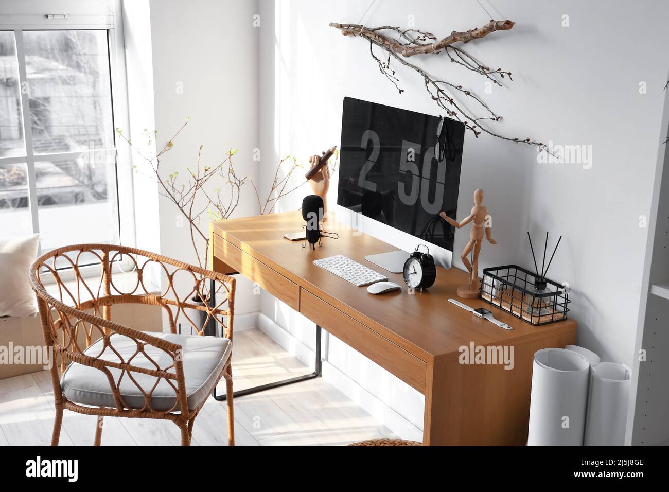 Workplace with modern computer, gadgets and decor near white wall Stock ...