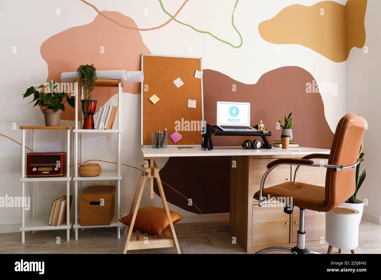 Modern workplace near color wall in room interior Stock Photo - Alamy