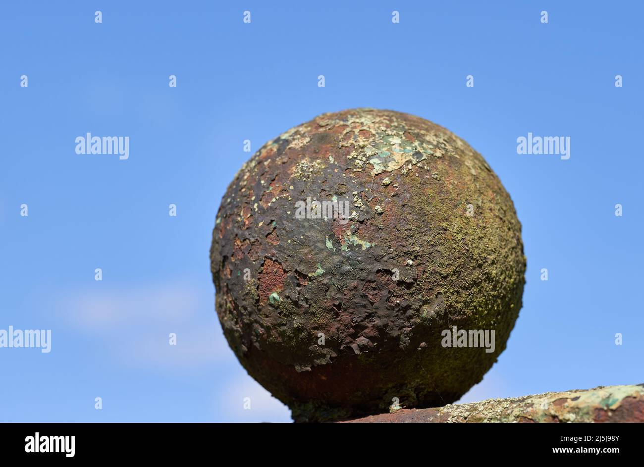 Rusty ornamental cast iron ball Stock Photo - Alamy