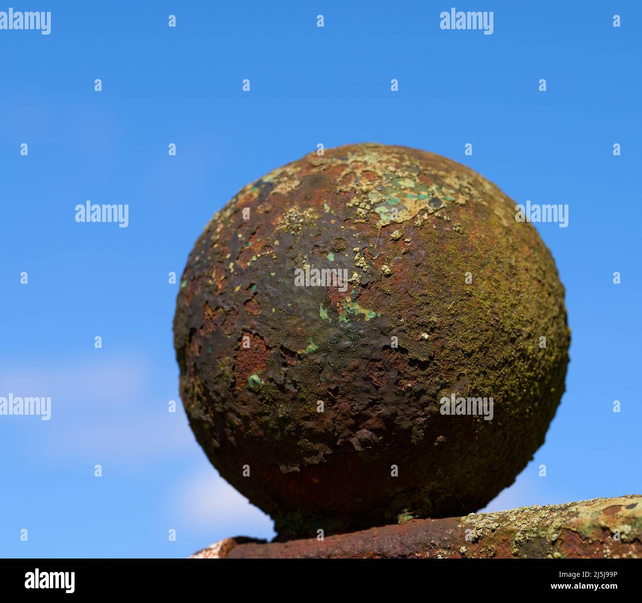 Rusty ornamental cast iron ball Stock Photo - Alamy