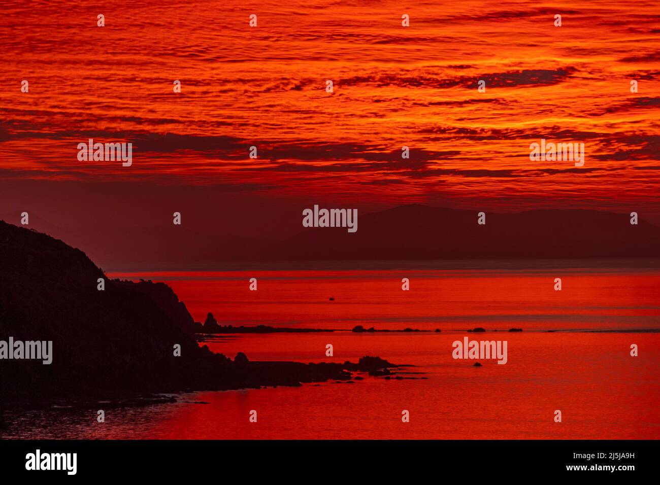 Red sunset over Cook Strait, from Titahi Bay, Porirua, Wellington ...