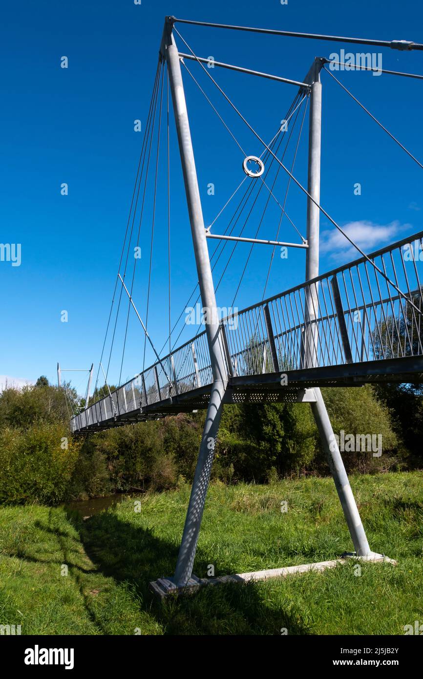 Modern suspension bridge on walking and cycling track over Waikanae ...