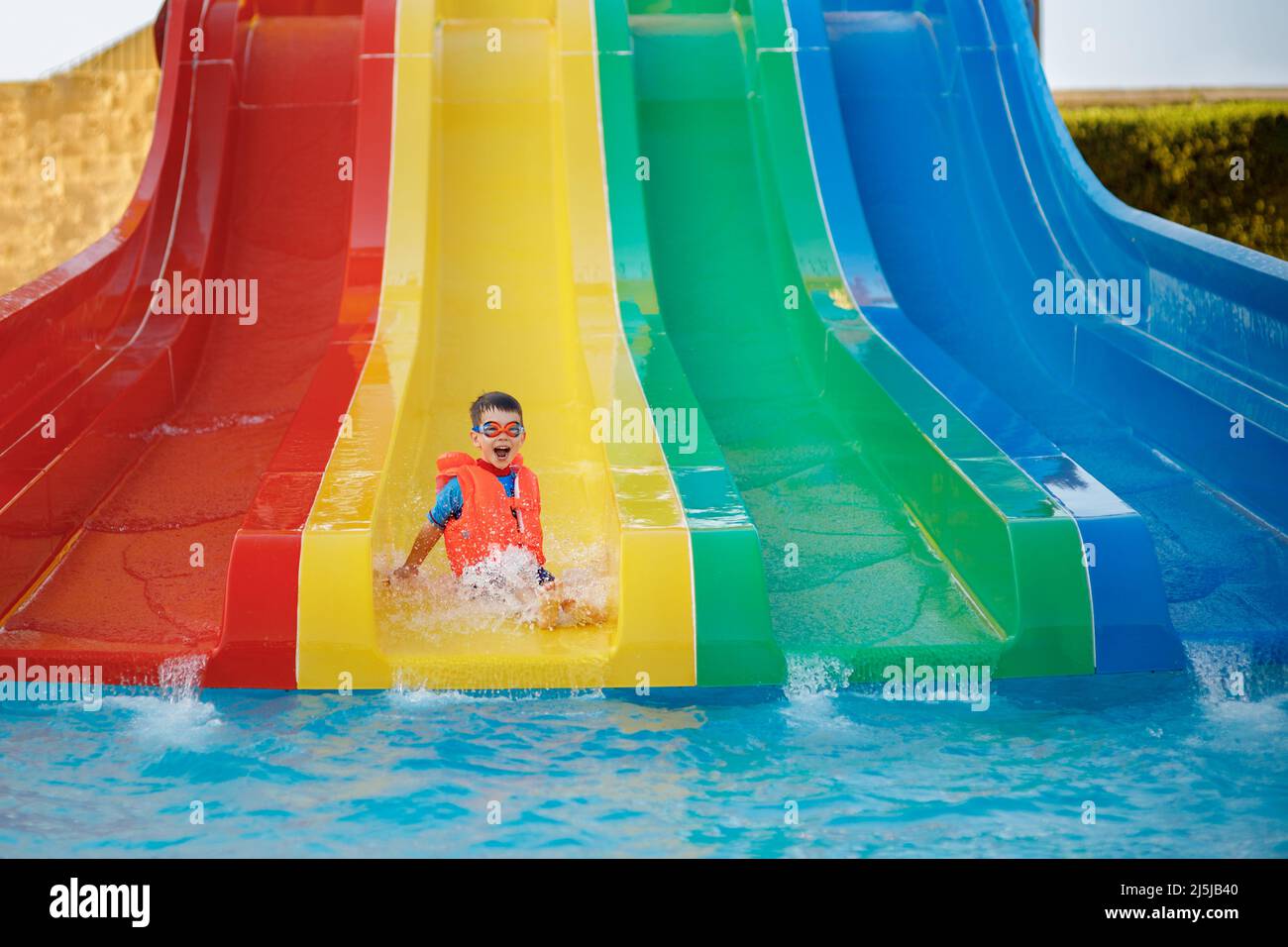 Boy water slide hi-res stock photography and images - Alamy