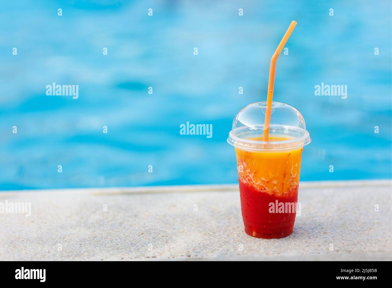 fresh mango with strawberry juice or smoothie near the pool Stock Photo ...