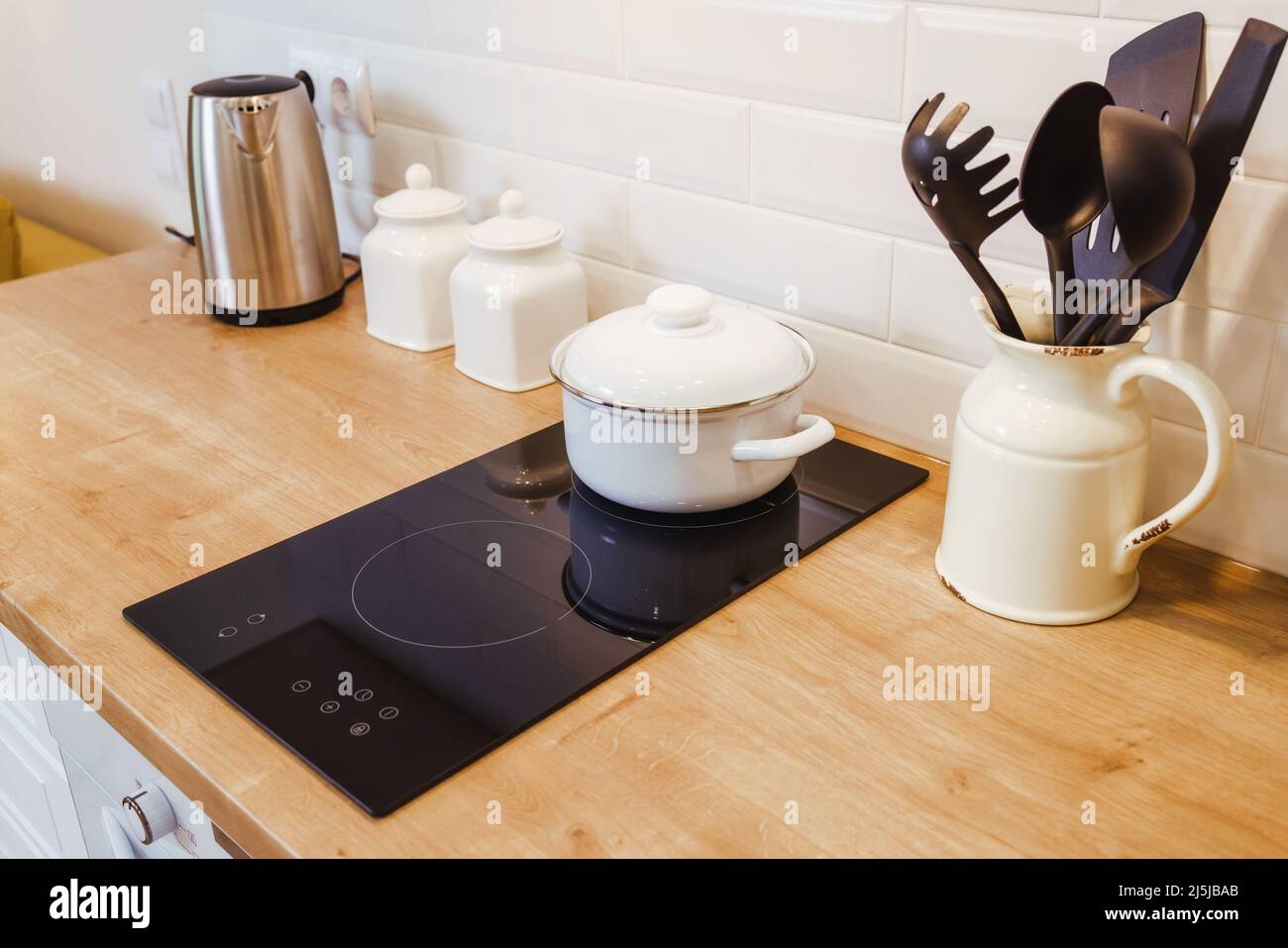 kitchen mockup with induction hob and wooden surface, copy paste Stock ...