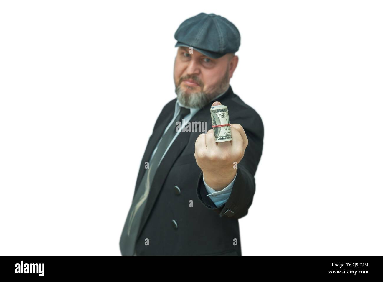 A man shows the middle finger on which dollars are rolled up into a ...