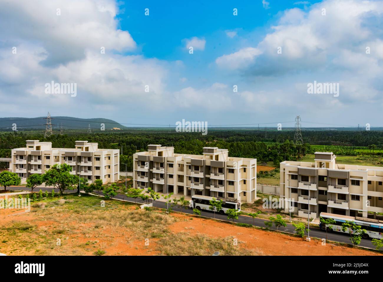 Top view of an Indian colony with bitumen road , building looking in ...