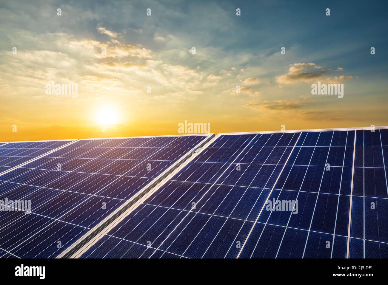 Solar panels and beautiful sunset clouds. green energy concept Stock ...