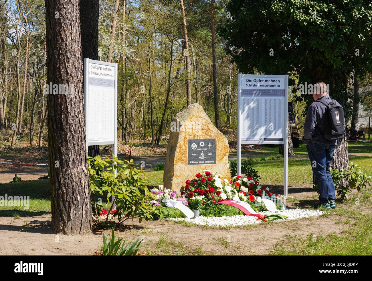 23 April 2022, Brandenburg, Schlieben: A man inspects the newly erected ...