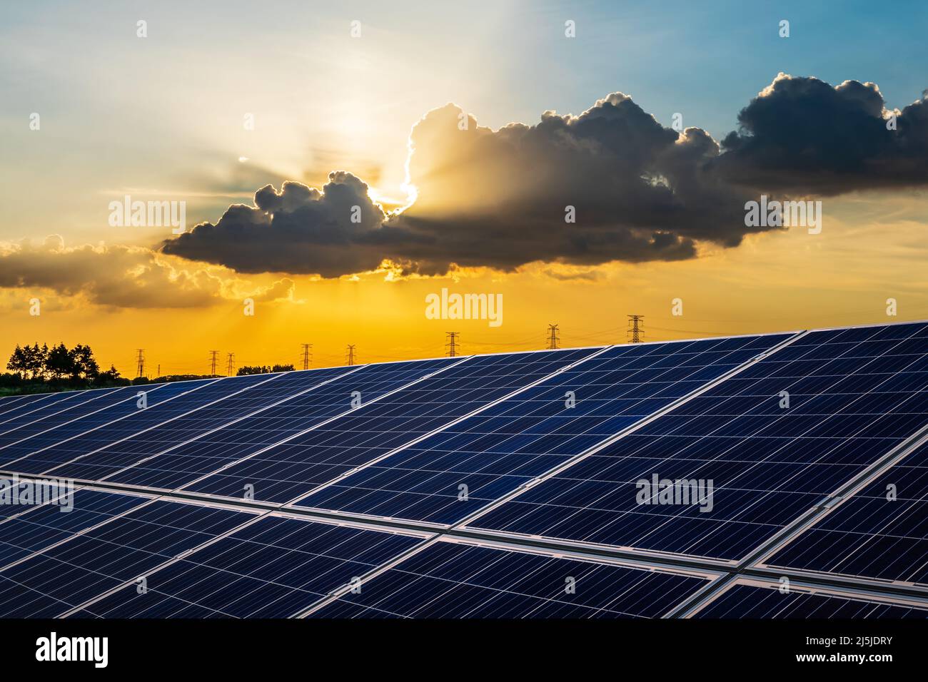 Solar panels and beautiful sky sunset clouds. Green energy concept ...