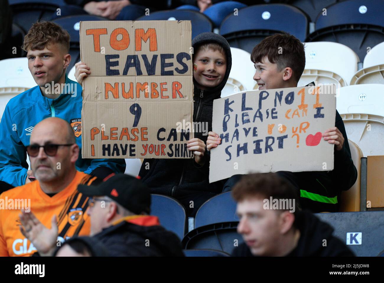 Two Hull City supporters hold up their home made signs for the players ...