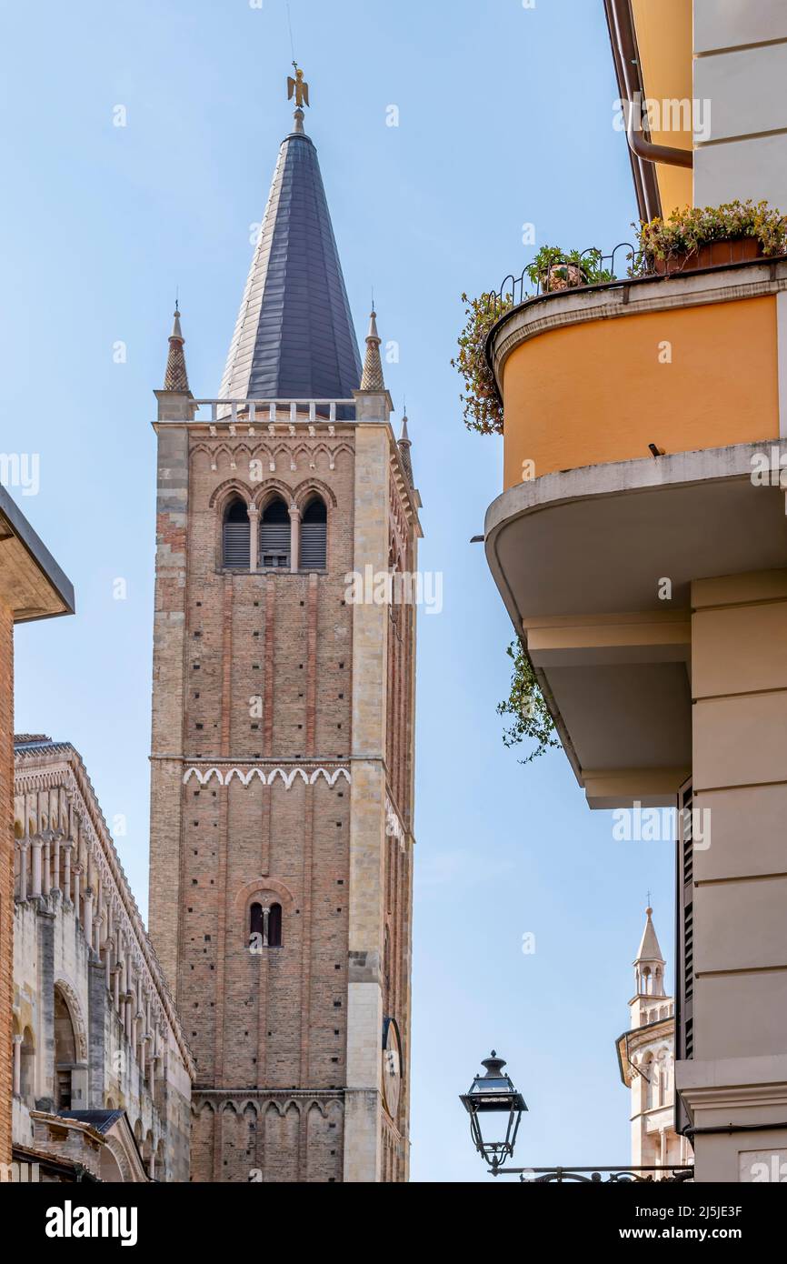 The bell tower of the cathedral of Parma, Italy, among the buildings of ...
