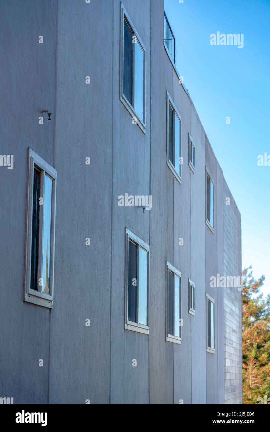 Dark gray building exterior with sliding glass window at San Francisco ...