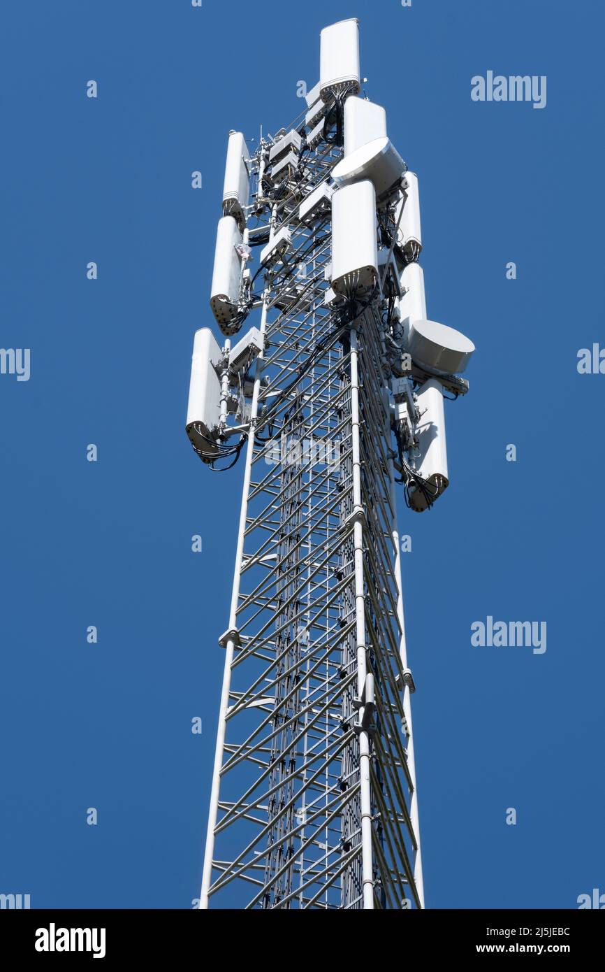 Top of transmission tower for telephone, radio and television at blue ...