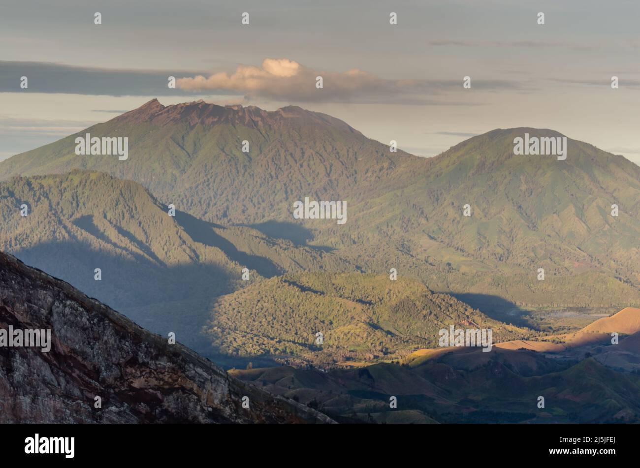 green volcano mountain in indonesia Stock Photo - Alamy
