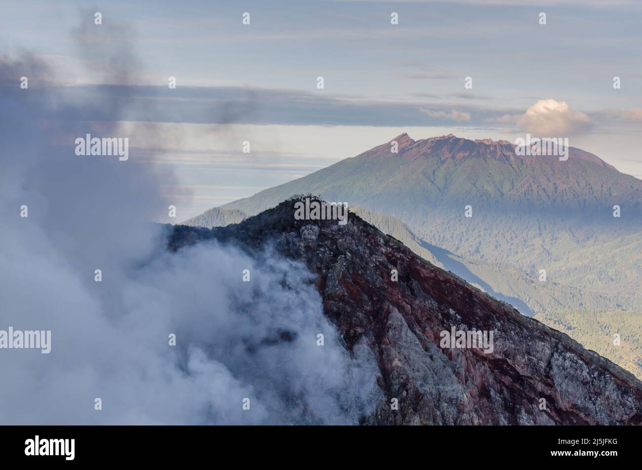 smoking volcano in bali indonesia Stock Photo - Alamy