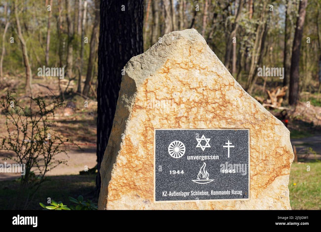 23 April 2022, Brandenburg, Schlieben: A memorial stone stands on the ...