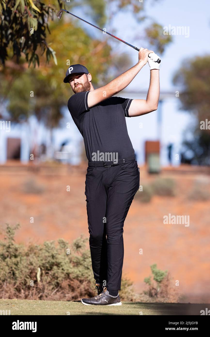 Karlkurla, Australia, 24 April, 2022. Haydn Barron hits a shot towards ...