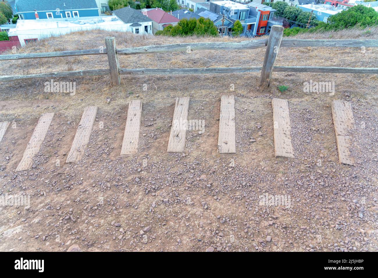 Wood planks strips on the dirt trail near the wooden fence at San ...
