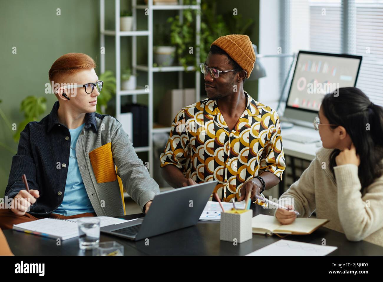 Diverse colleagues collaborating sharing ideas hi-res stock photography ...