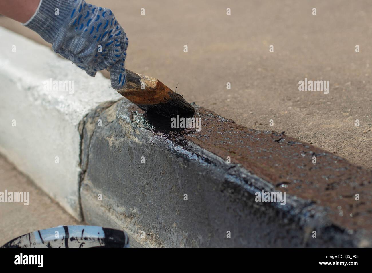 Paint for the street. Painting the object. Marking the road. Work with ...