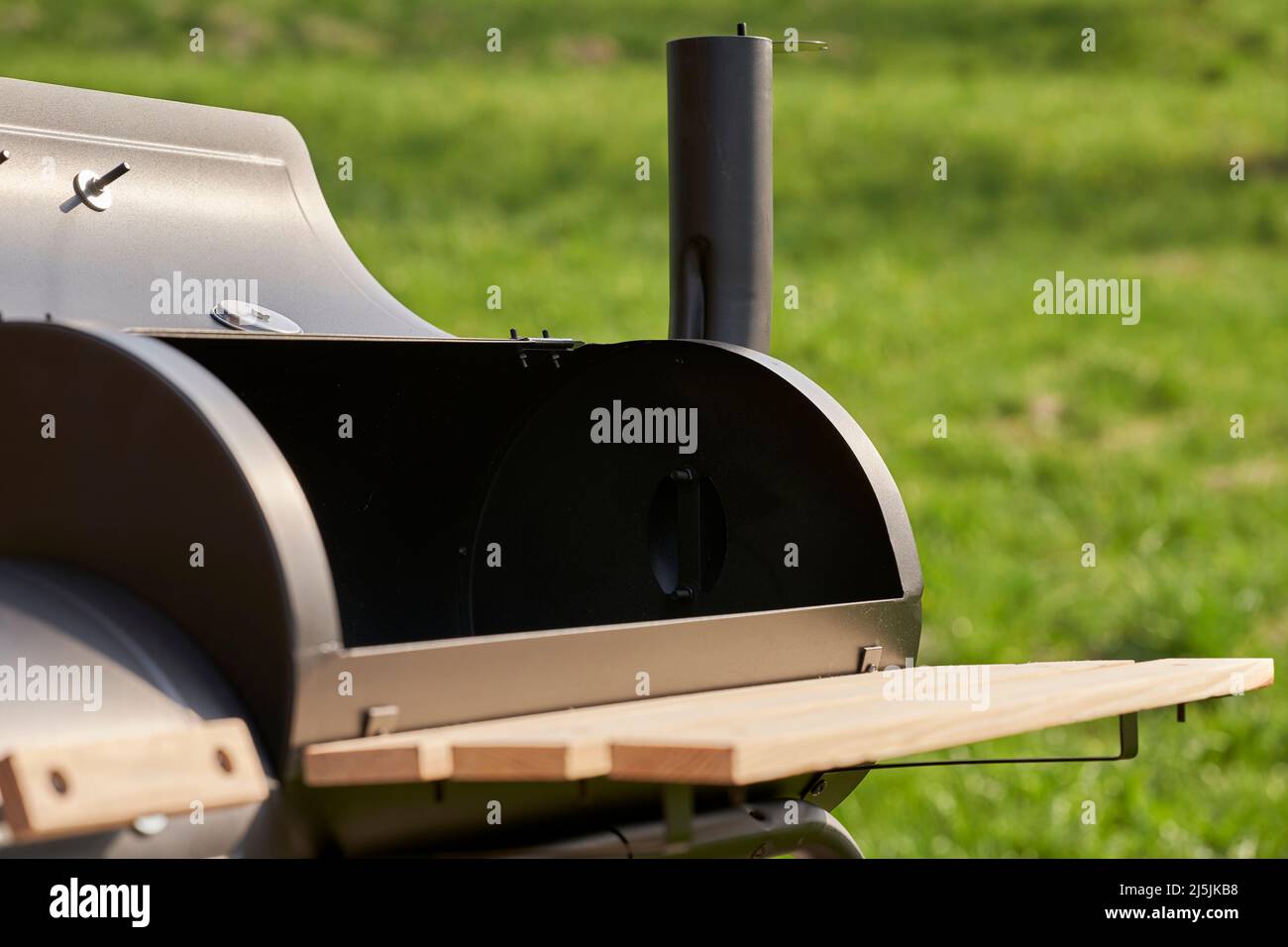 New smoker barbecue grill. Equipment for cooking and smoking. Device in ...