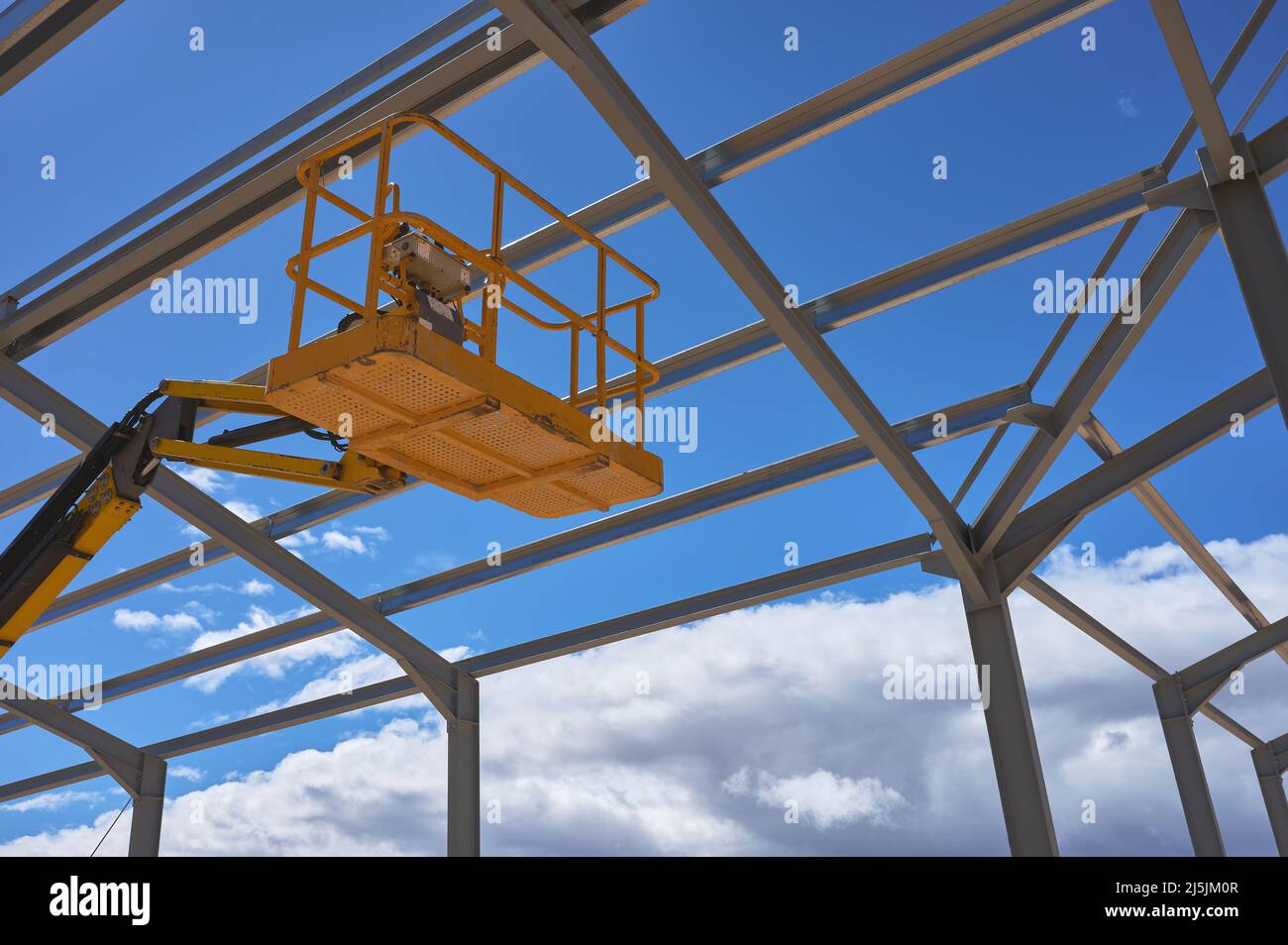 detail of a yellow elevating platform for construction in the ...