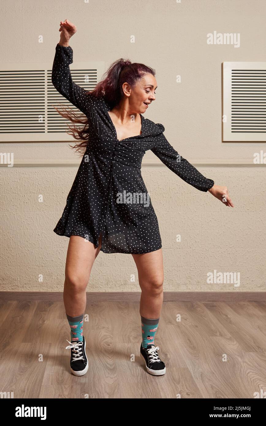 Senior woman dancing lindy hop in a studio Stock Photo - Alamy