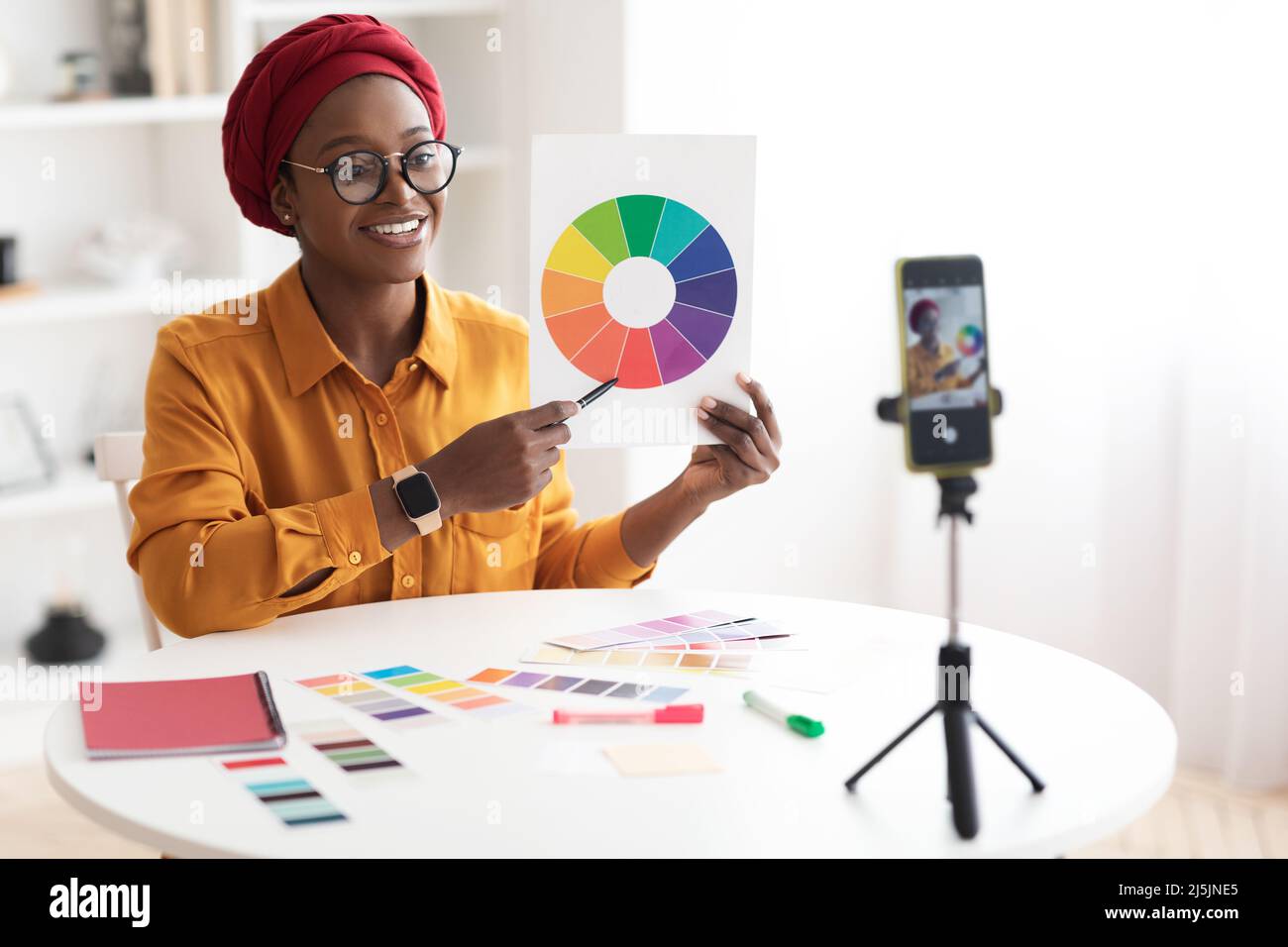 Stylish black woman famous designer broadcasting from home Stock Photo ...