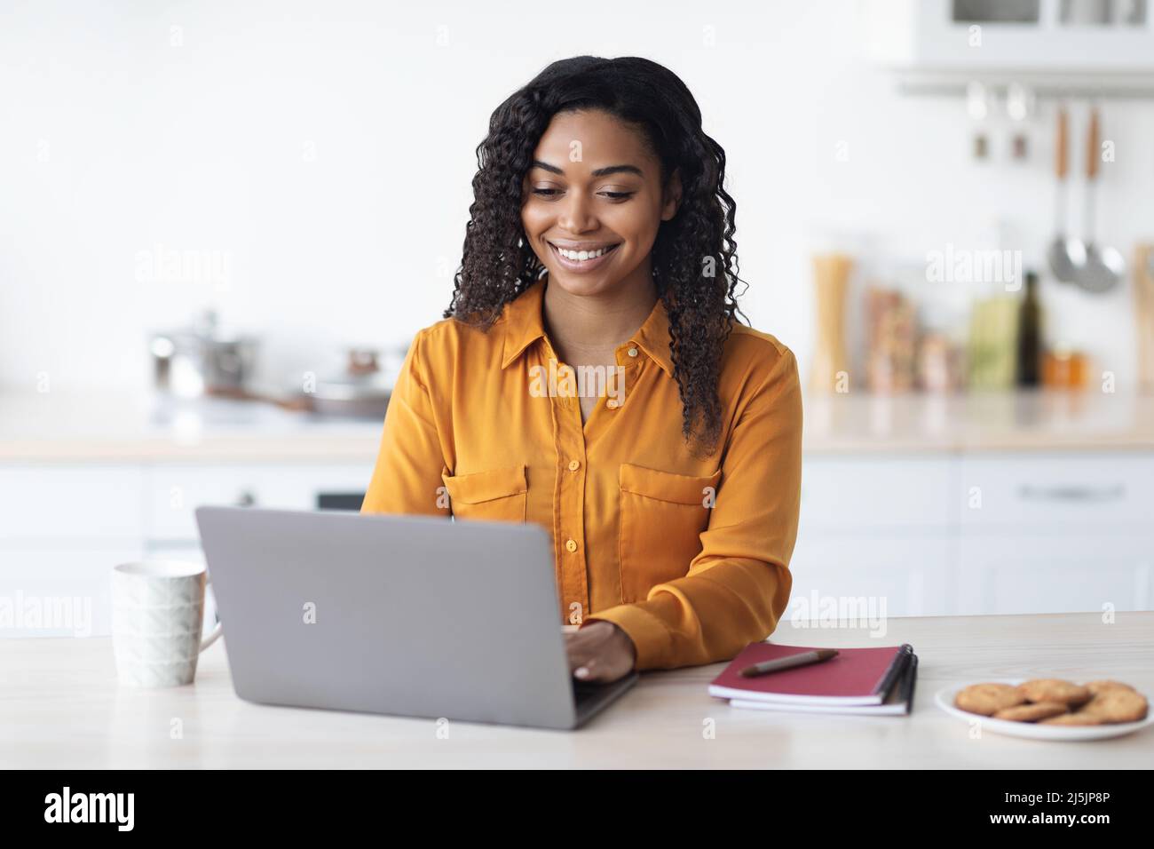 Student happy home typing hi-res stock photography and images - Alamy