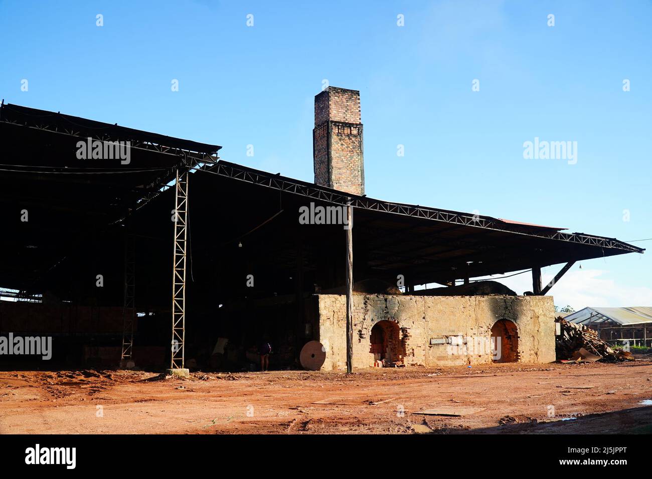Old red truck loaded and overloaded with freshly baked bricks near ...