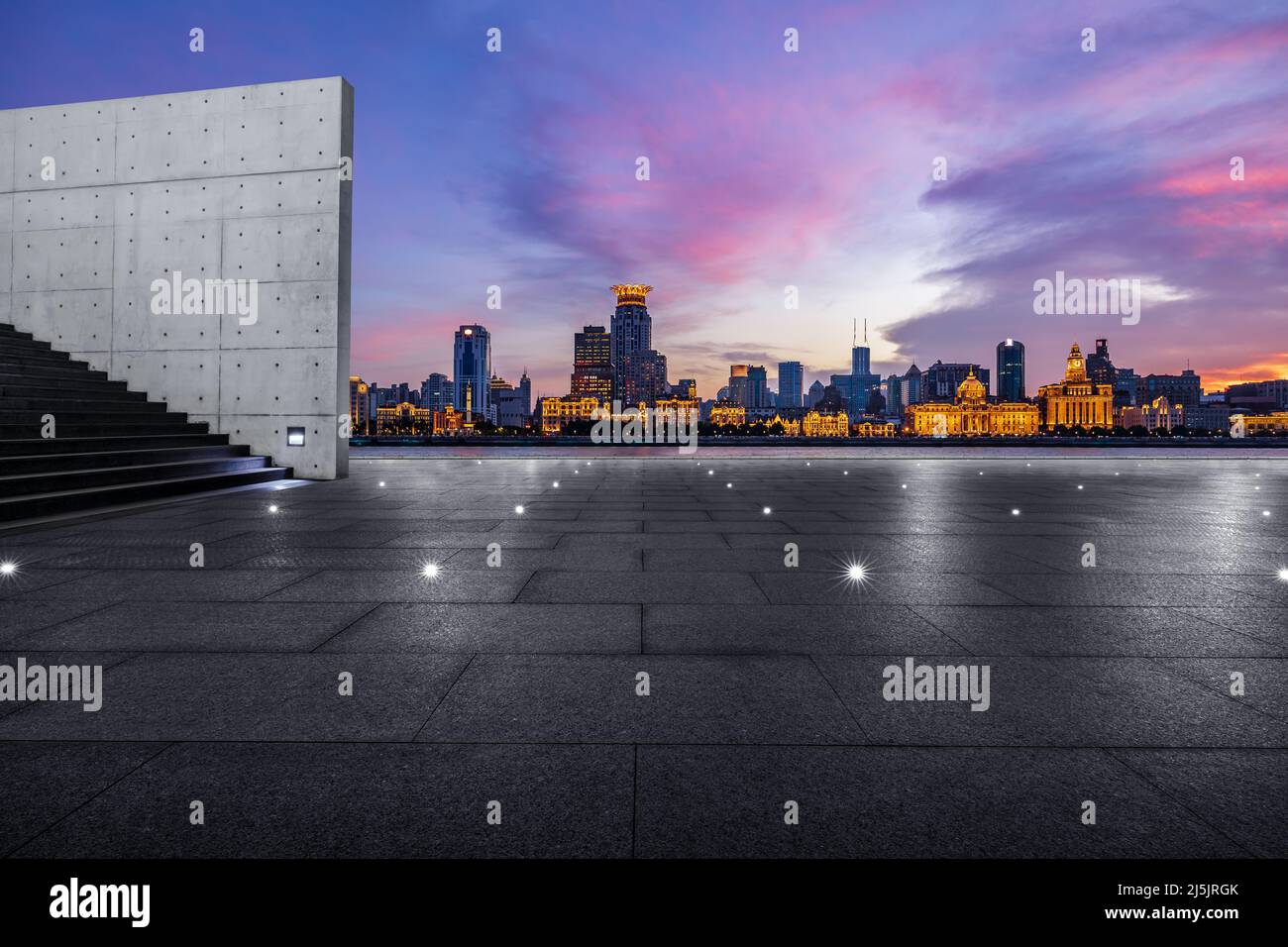 Empty square floor and city skyline with buildings in Shanghai at night ...