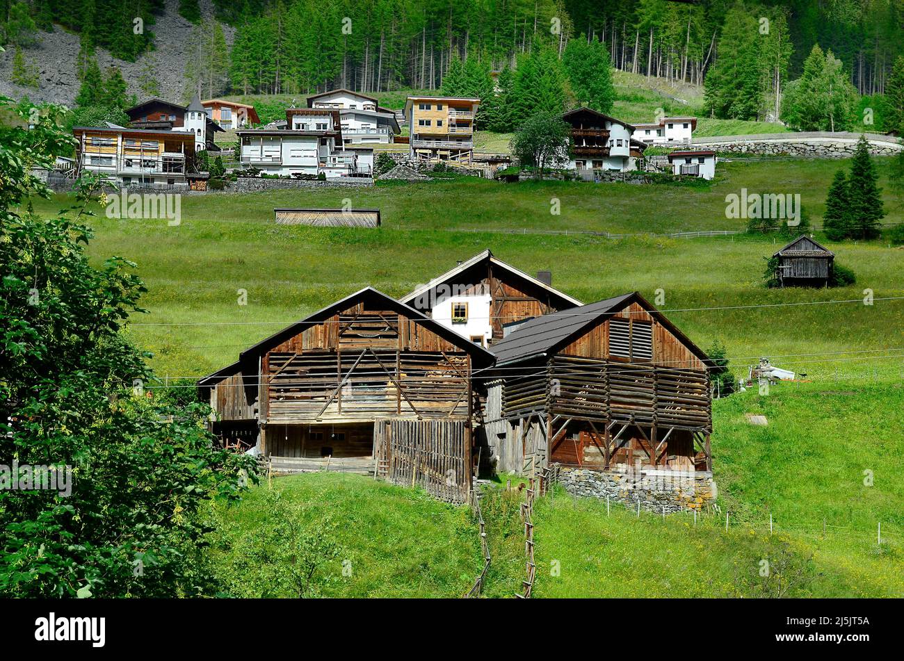 Austria, Tyrol, homes and barn in mountain village in Pitztal-valley ...