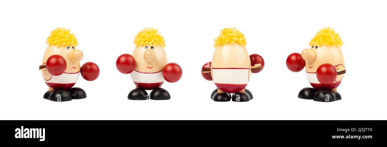 Set of egg-shaped wooden doll with red boxer gloves Stock Photo - Alamy