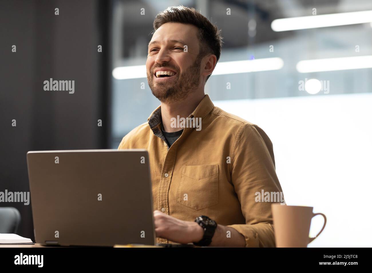 Bearded guy using laptop workplace hi-res stock photography and images ...