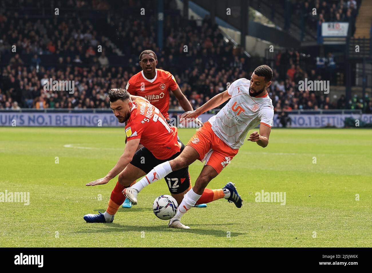 CJ Hamilton #22 of Blackpool wins the ball from Robert Snodgrass #12 of ...