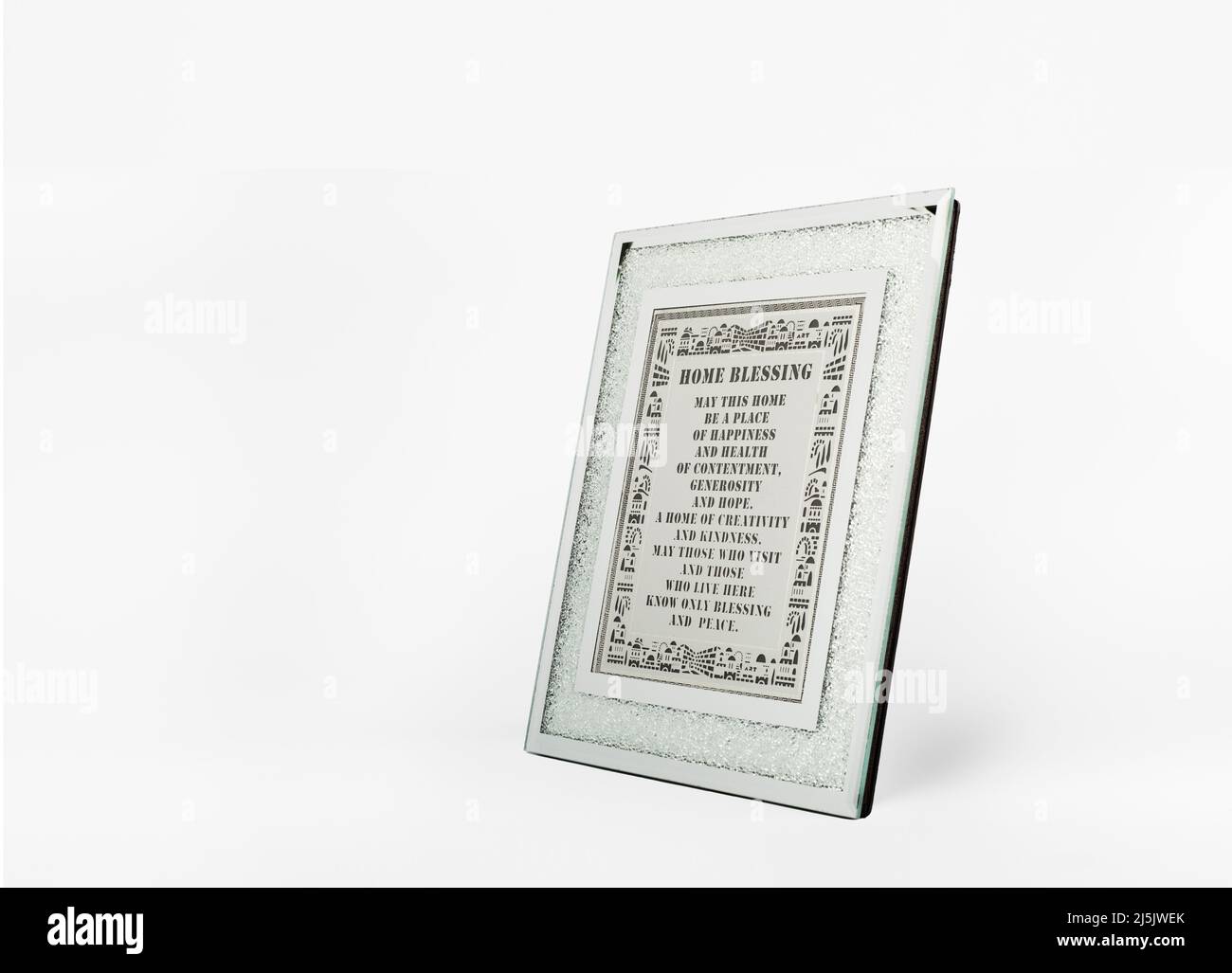 A shining silver picture frame with blessing home on white background ...