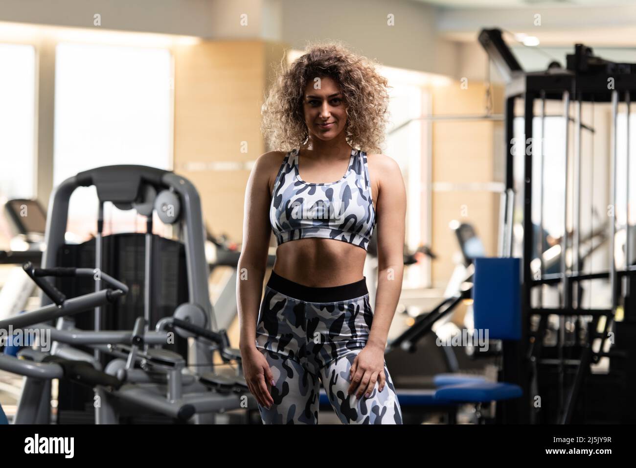 Portrait Of A Young Physically Fit Woman Showing Her Well Trained Body ...
